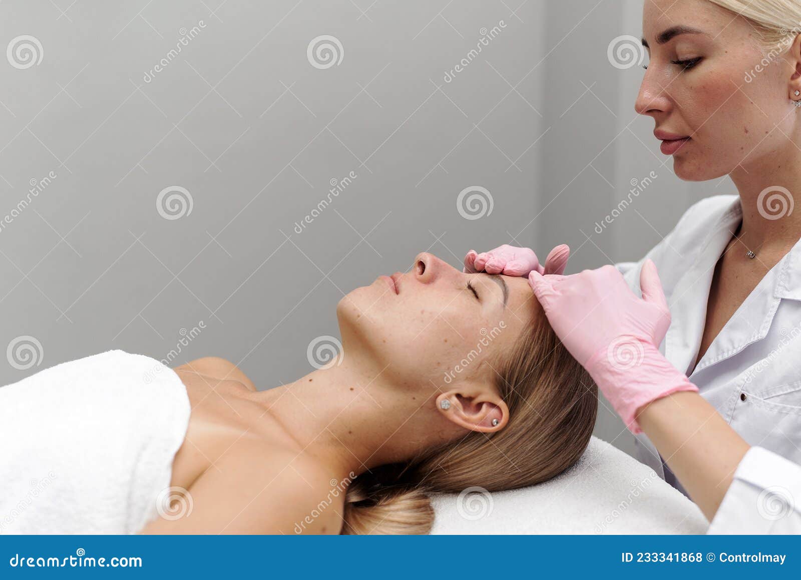 Beautician Or Masseur Doing Manual Relaxing Rejuvenating Face And Neck
