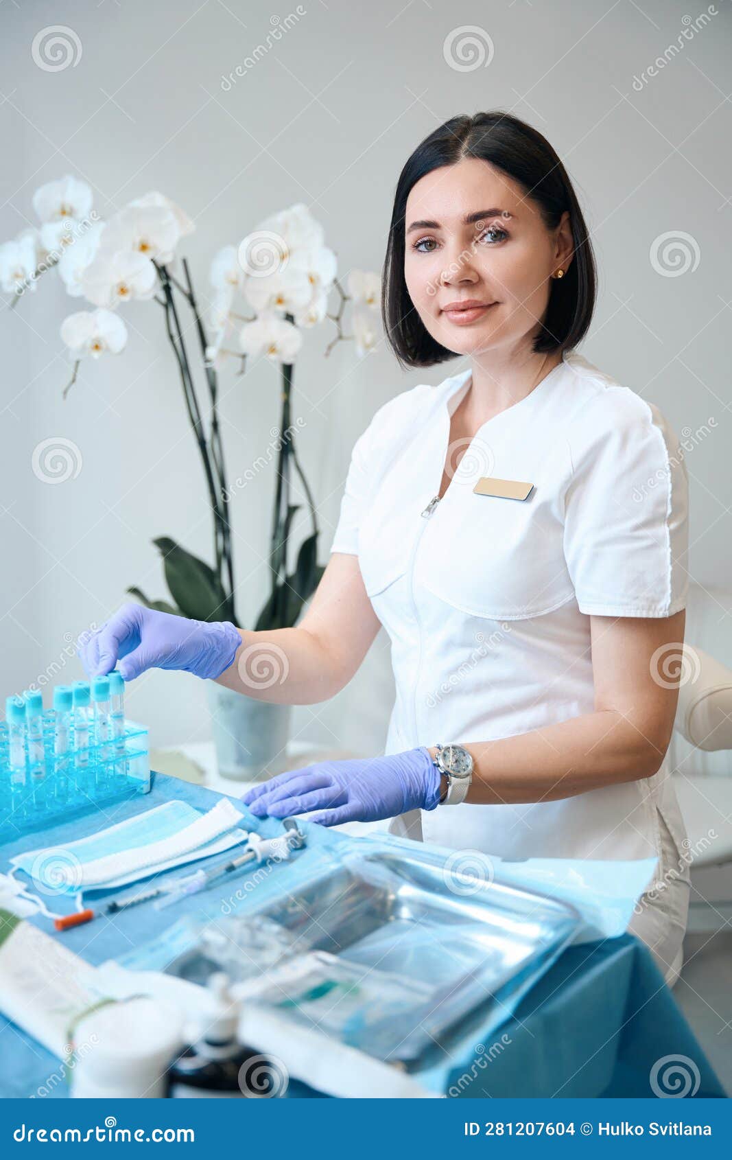 Beautician Wearing Medical Gloves And Sitting In Cosmetology Office