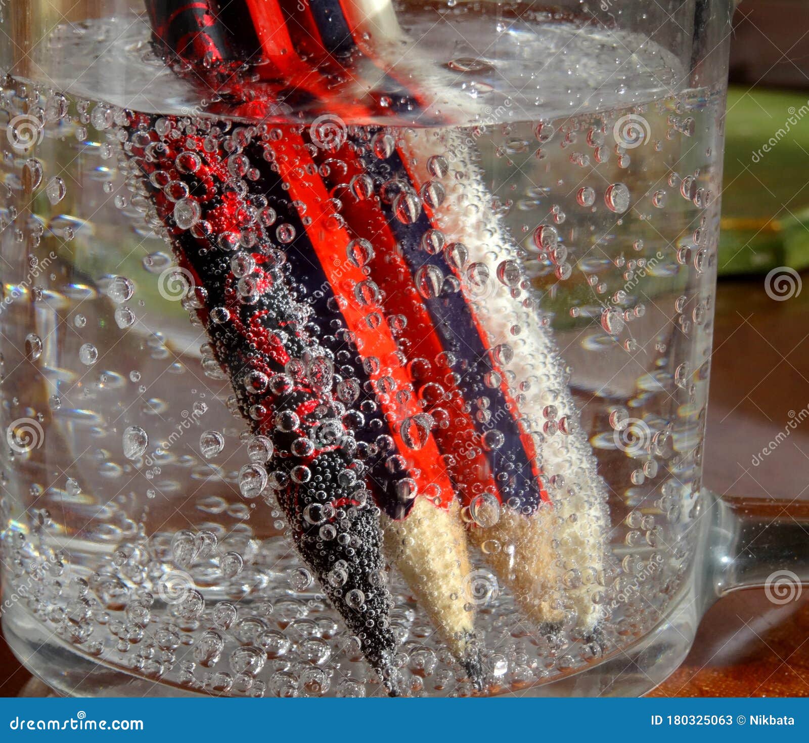 Beautiful Abstract Background with Colored Pencils Immersed in Liquid ...