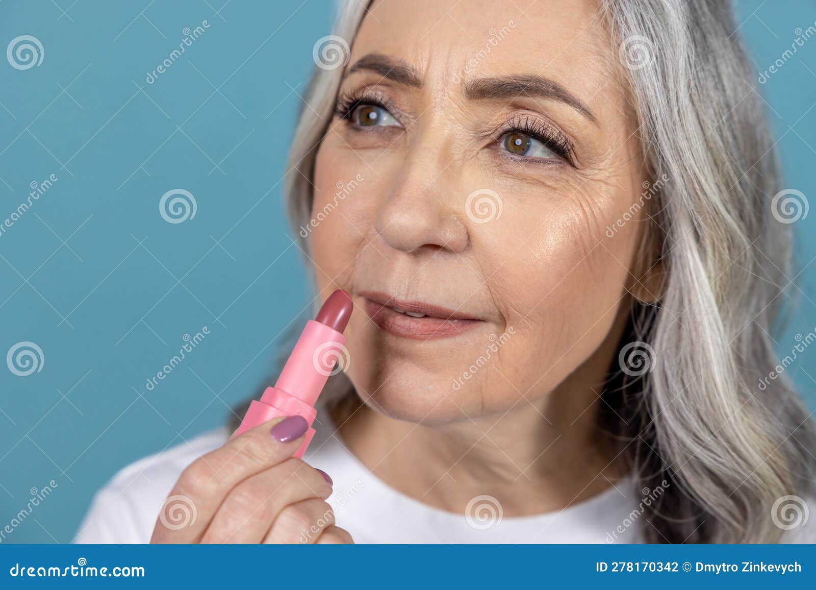 Beautiful Aging Woman with Lipstick Doing Makeup Stock Photo - Image of ...