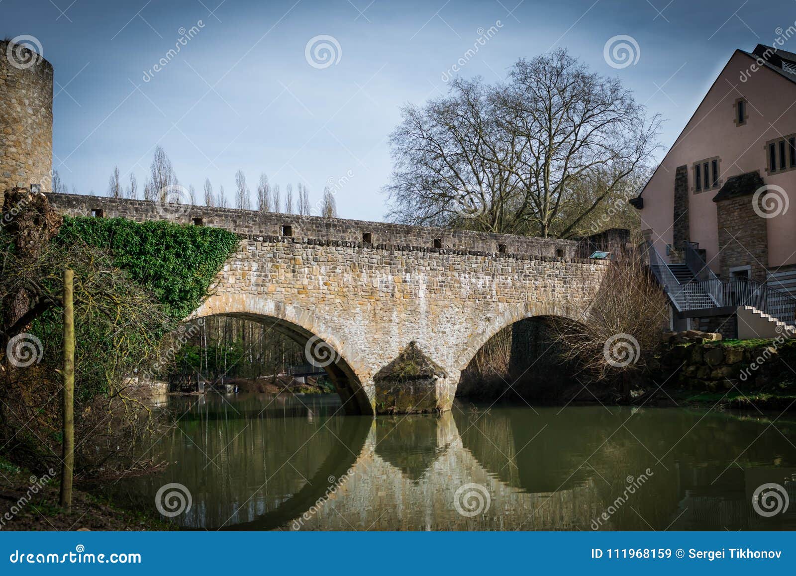 Beautiful Antique Bridge with Plants on Top Over the River at Old Town ...
