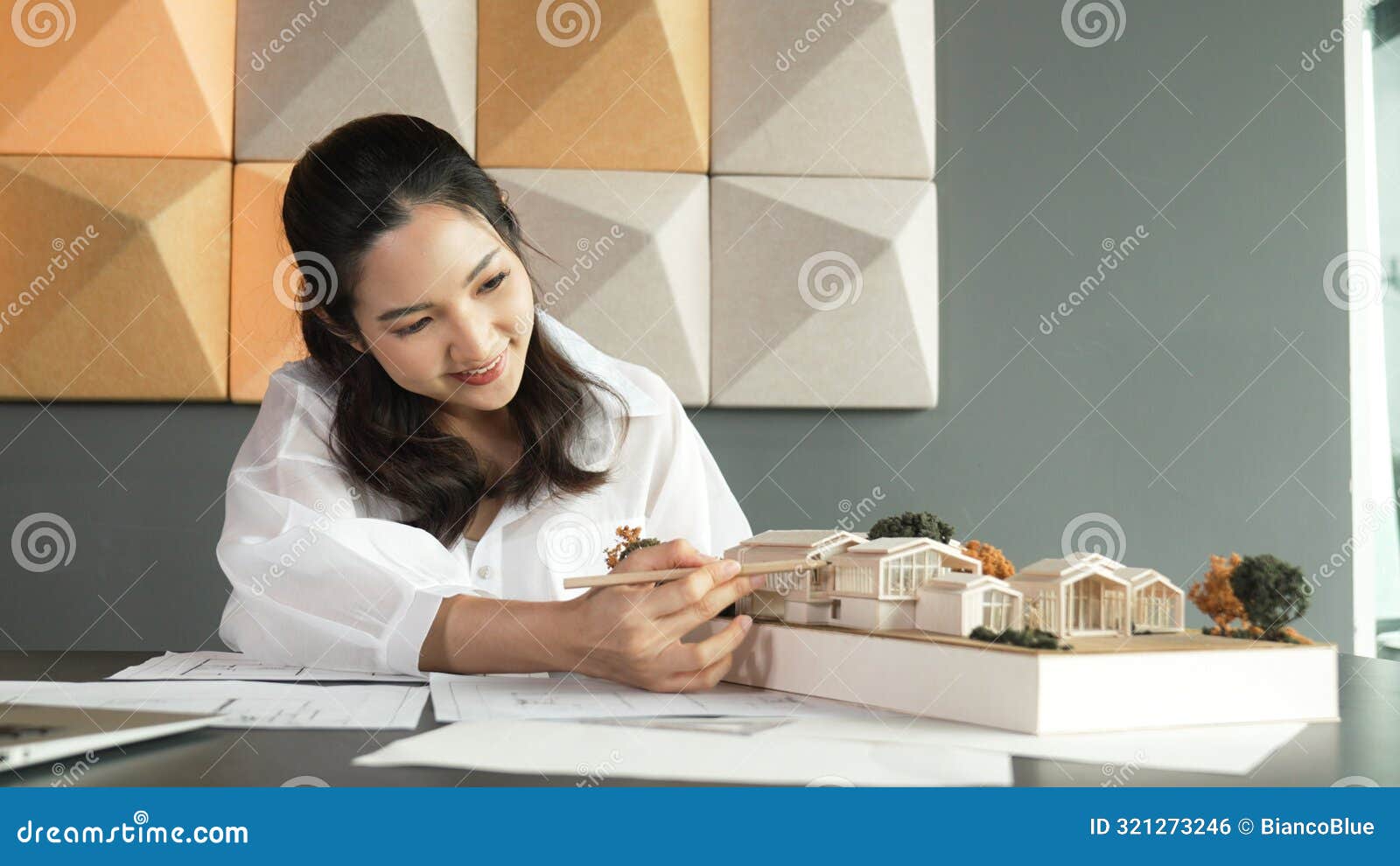 Beautiful Architect Measuring House Model while Taking a Note ...