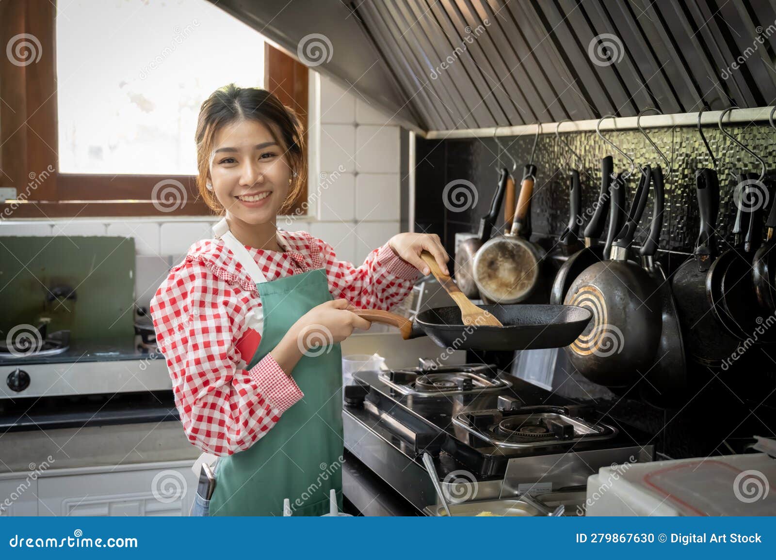 Beautiful Asian Home Cook Girl Wearing Apron And Holding Wooden Spatula