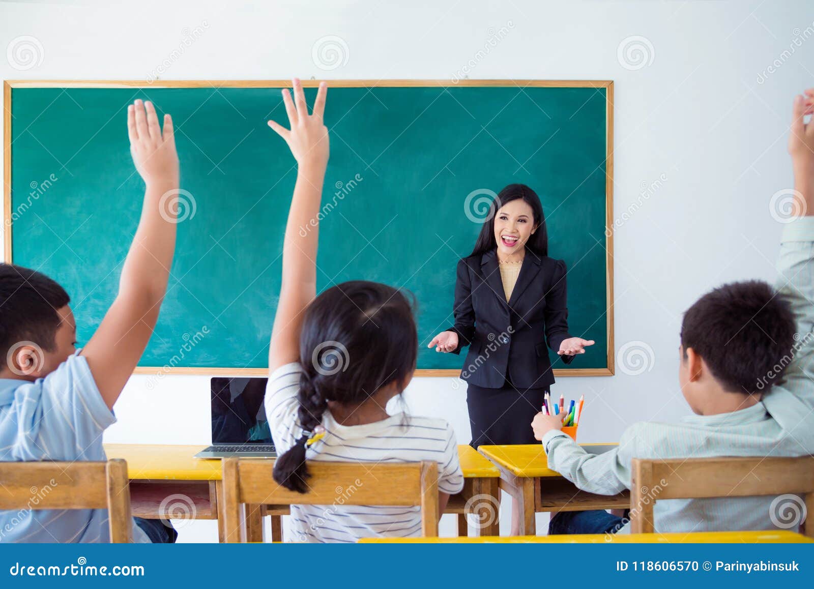 Teacher Teaching Student in Classroom Stock Photo - Image of female ...