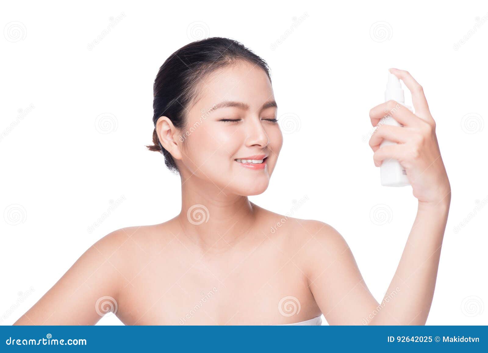 Beautiful Asian Woman Applying Spray Water On Face Isolated Whit Stock