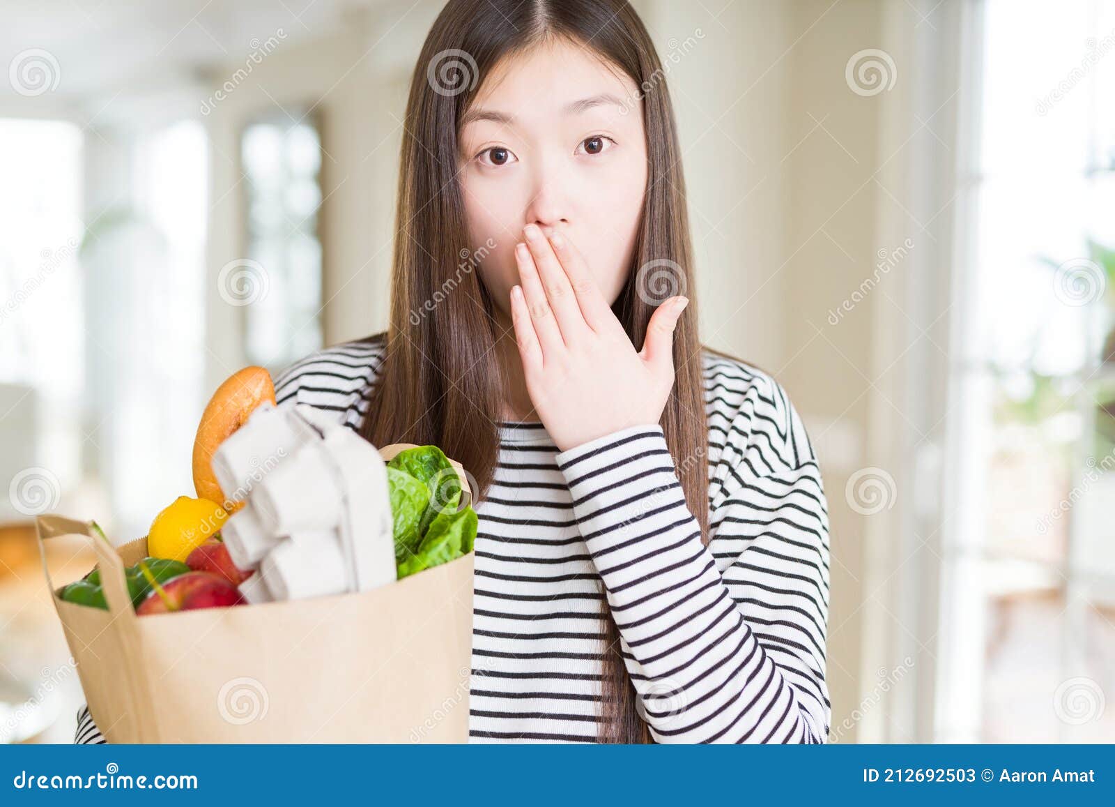 Beautiful Asian Woman Holding Paper Bag Of Fresh Groceries Cover Mouth