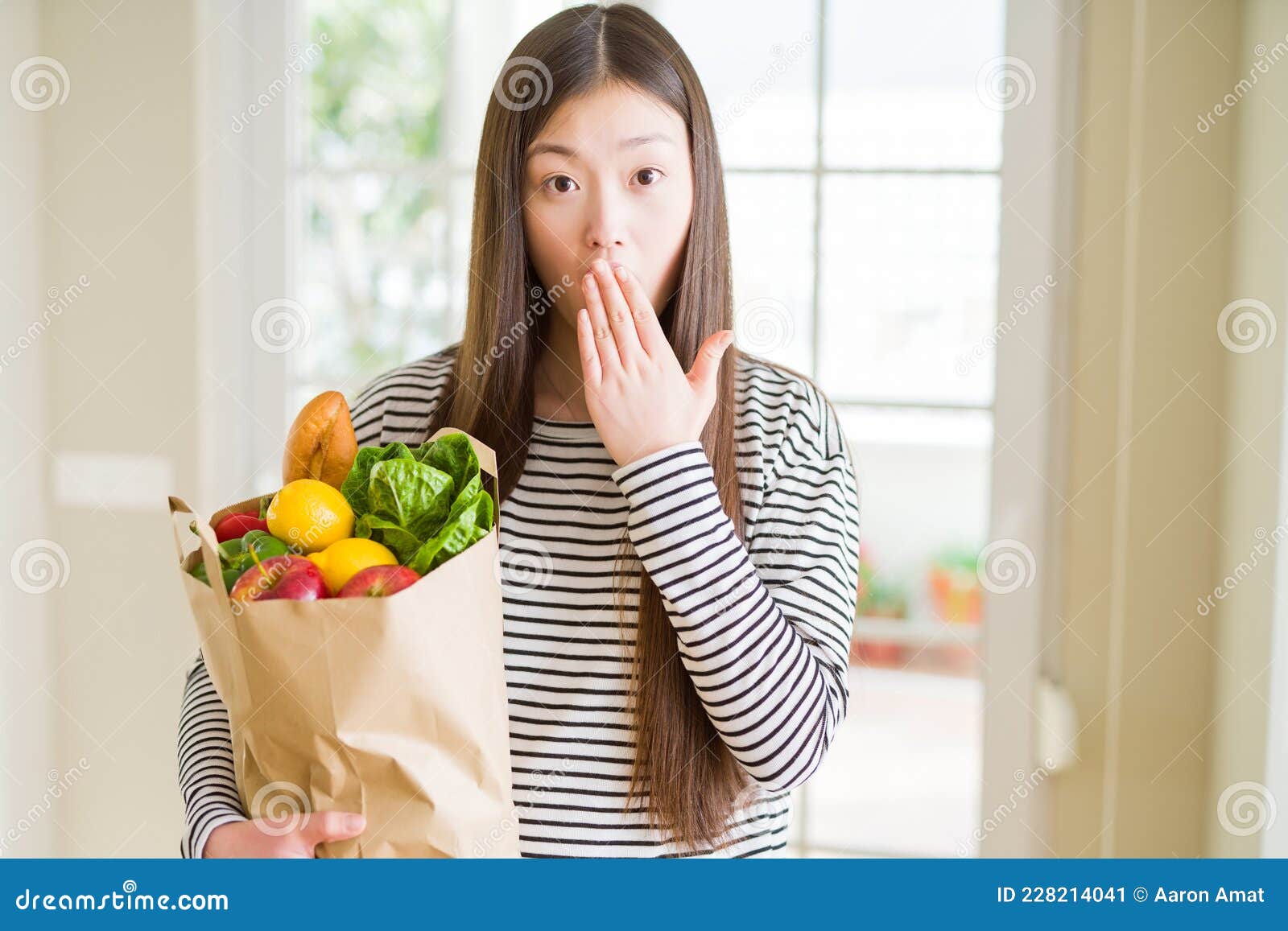 Beautiful Asian Woman Holding Paper Bag Of Fresh Groceries Cover Mouth