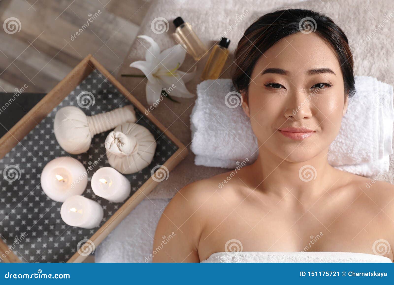 Beautiful Asian Woman Lying On Massage Table In Salon Stock Image