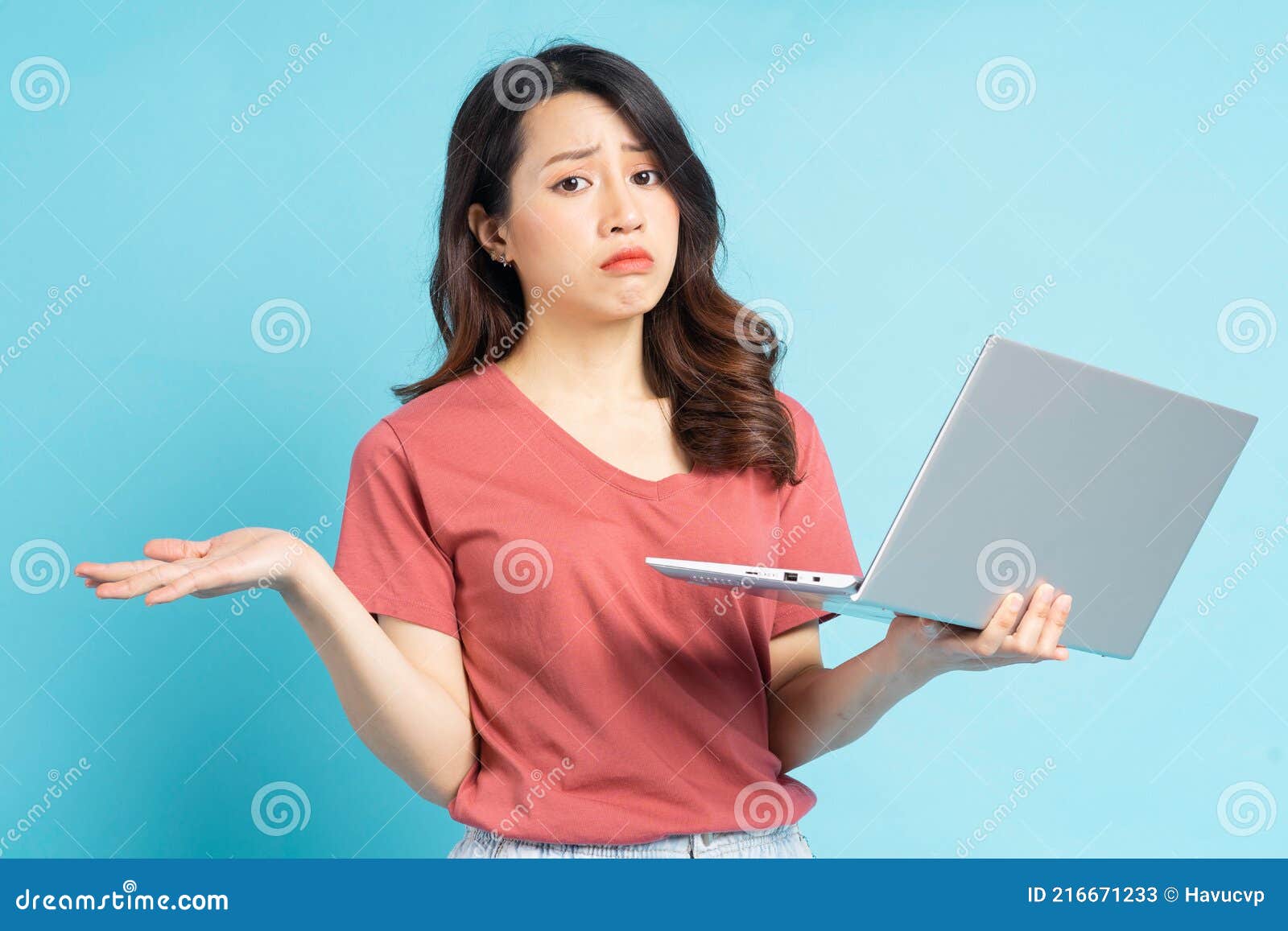 Beautiful Asian Woman Using Laptop with a Puzzled Expression Stock ...