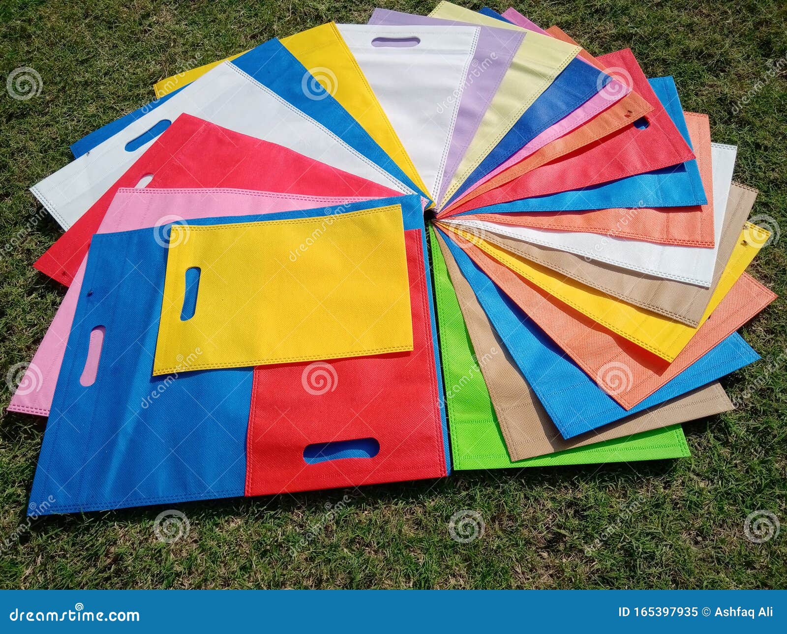 Beautiful Assorted Color Fabric Bags on Grass Stock Image - Image of ...