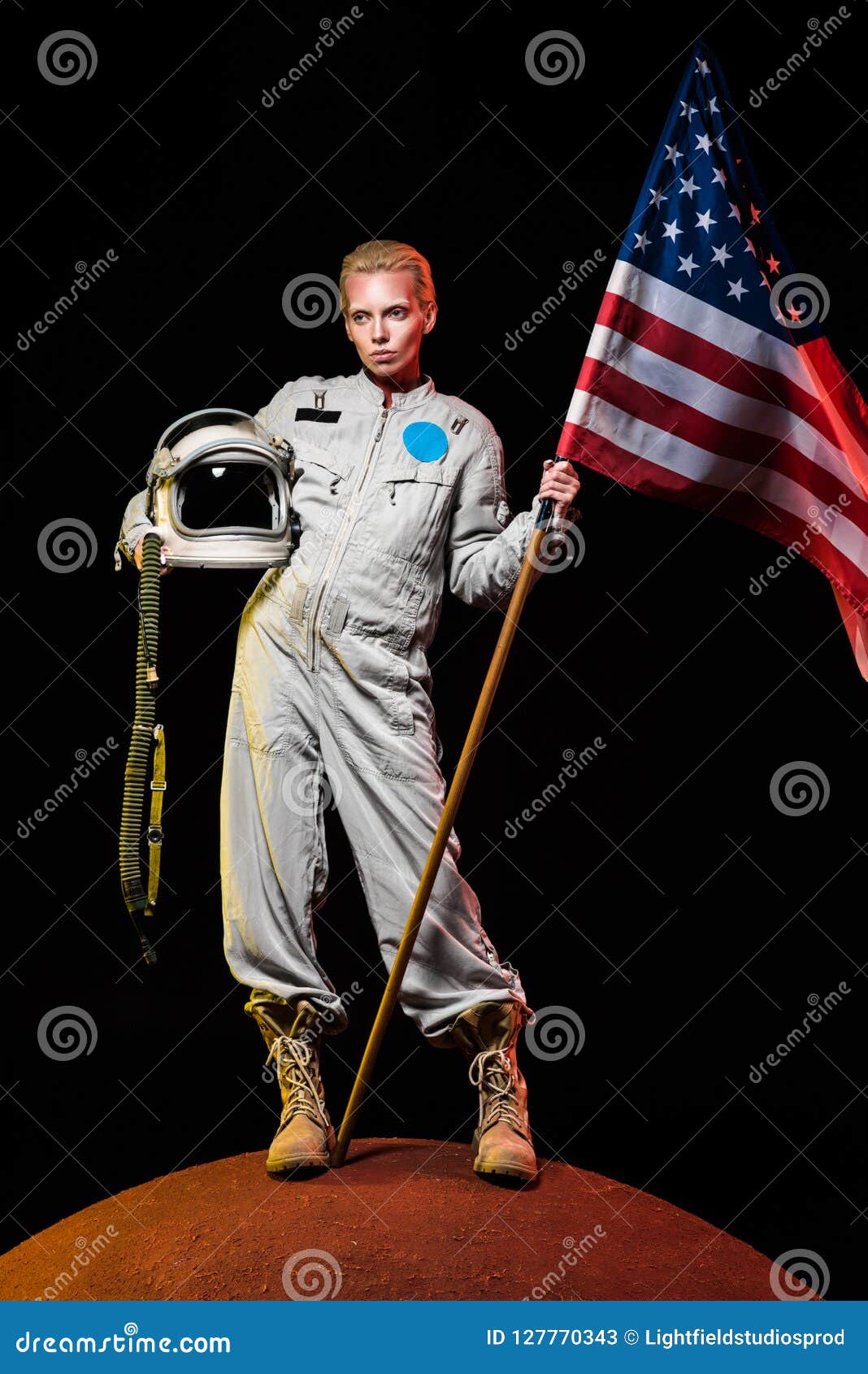 Beautiful Astronaut in Spacesuit Holding Helmet and American Flag on ... Beautiful Astronaut in Spacesuit Holding Helmet and American Flag on ...