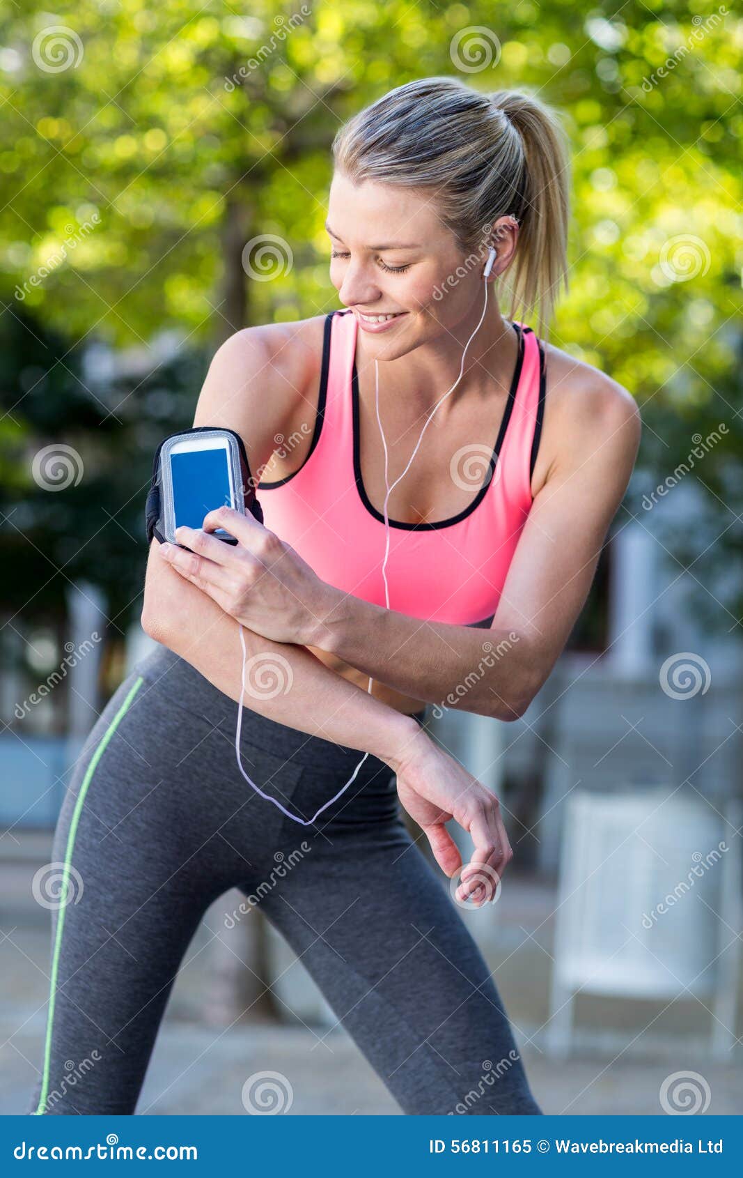 A Beautiful Athlete Using Her Phone Stock Image - Image of physical ...