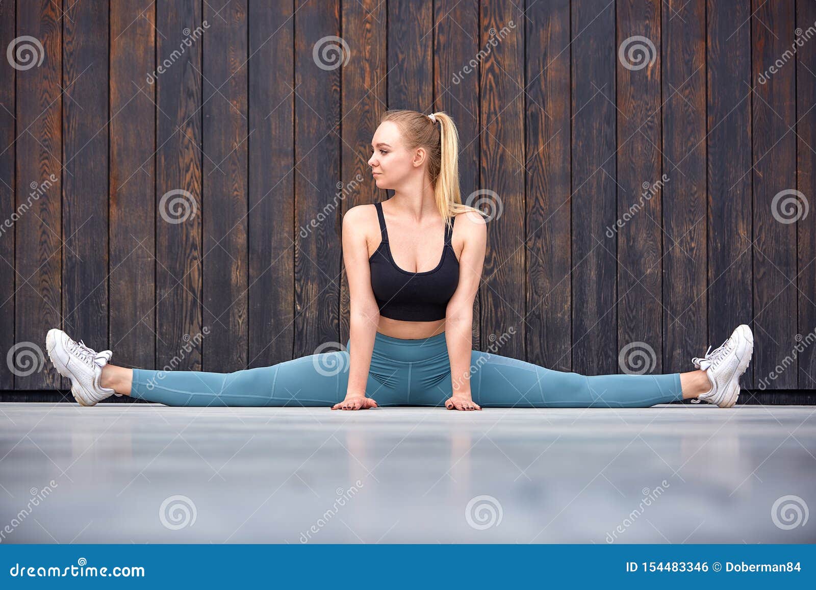 Beautiful Athletic Young Girl Gymnast In Sportswear Working Out