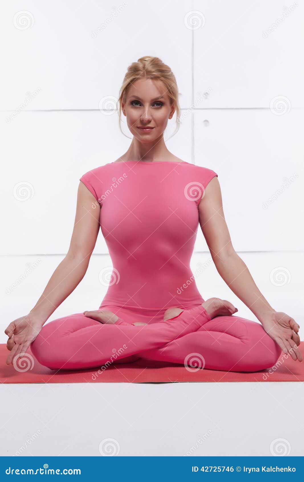 Beautiful Attractive Blond Woman Doing Yoga Sitting In The Lotus