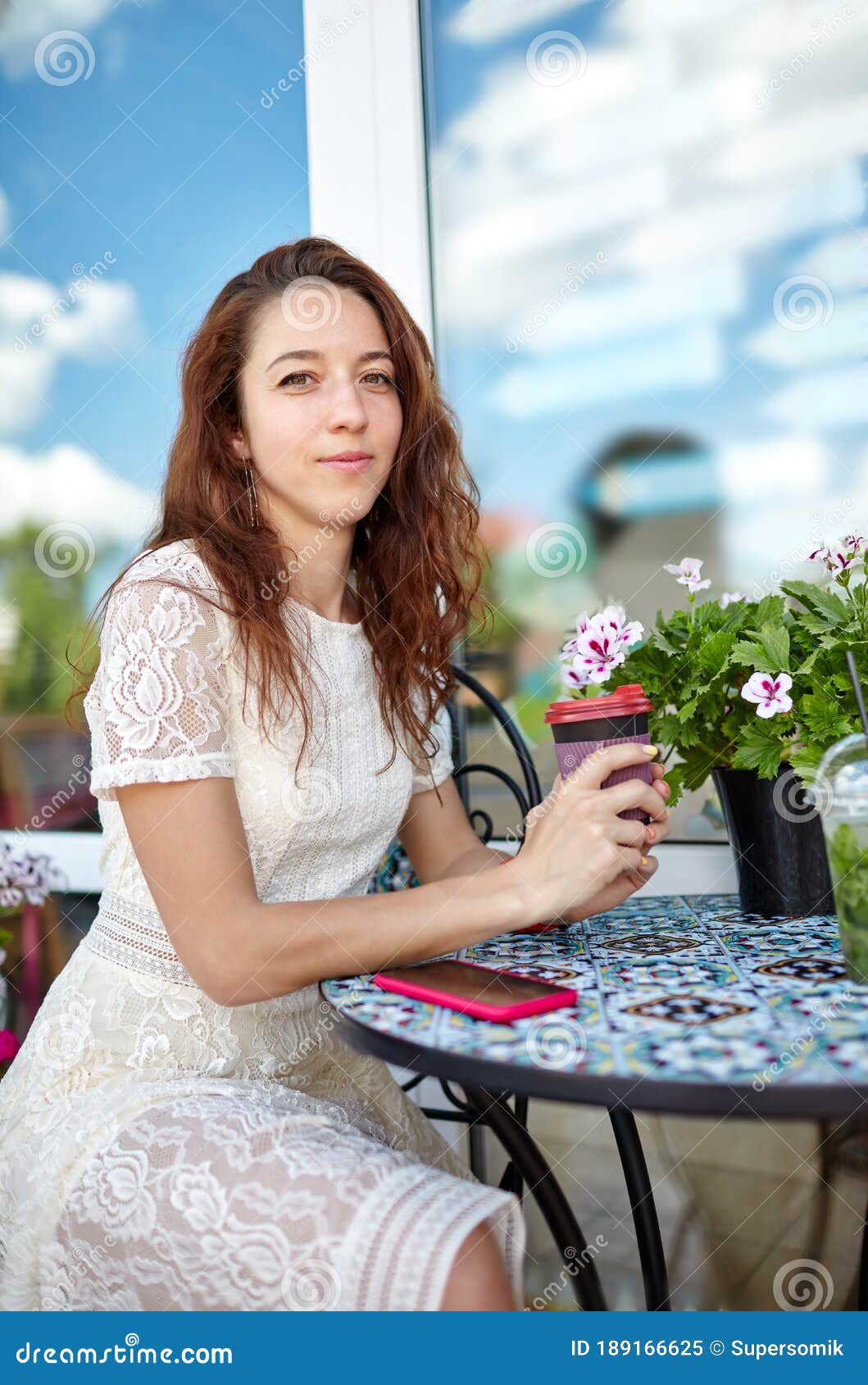 Beautiful Attractive Woman Drinks Cofee In The Cafe Coffee Break Stock