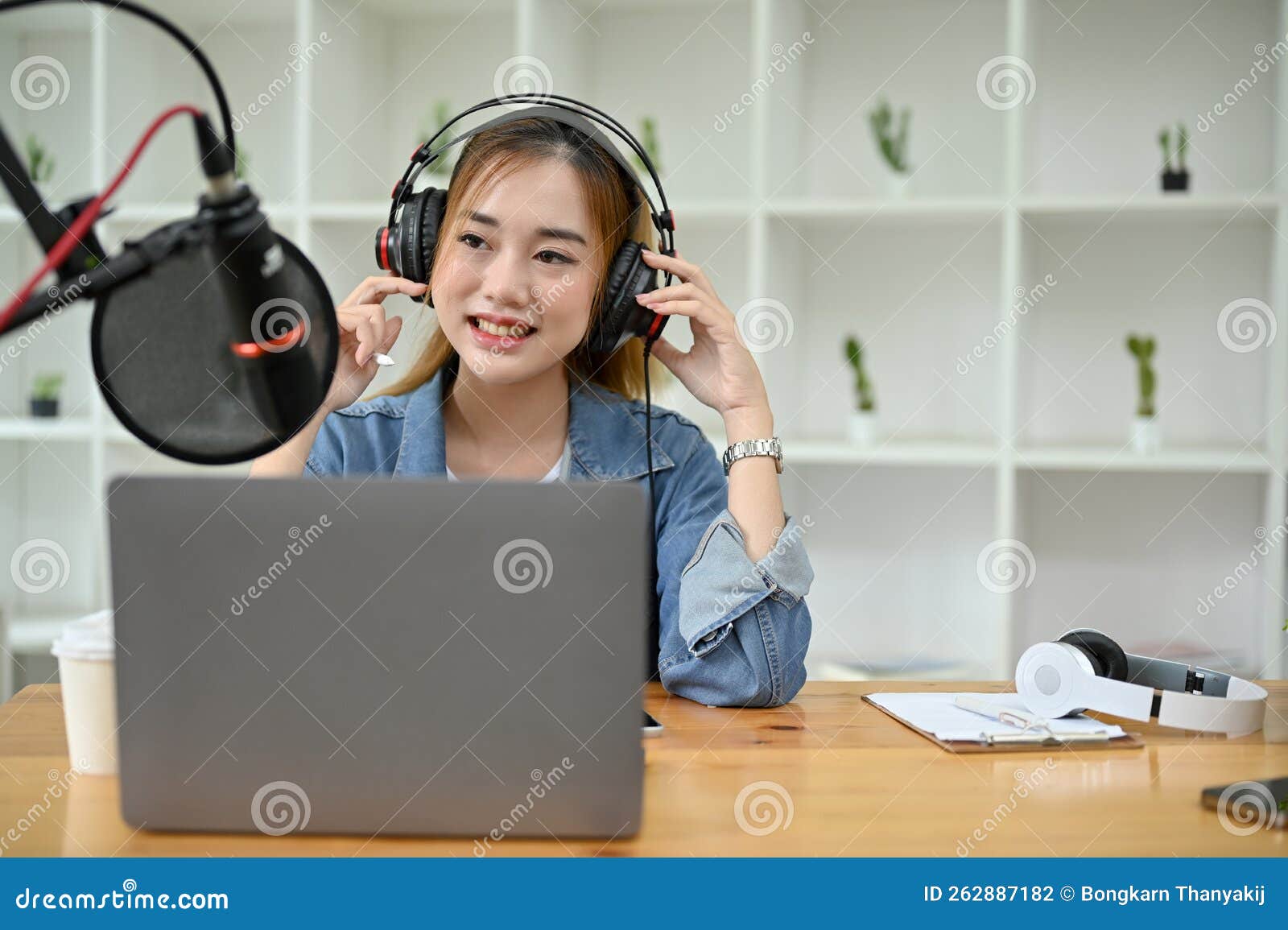 Attractive Asian Female Radio Host Or Podcaster Running Her Podcast