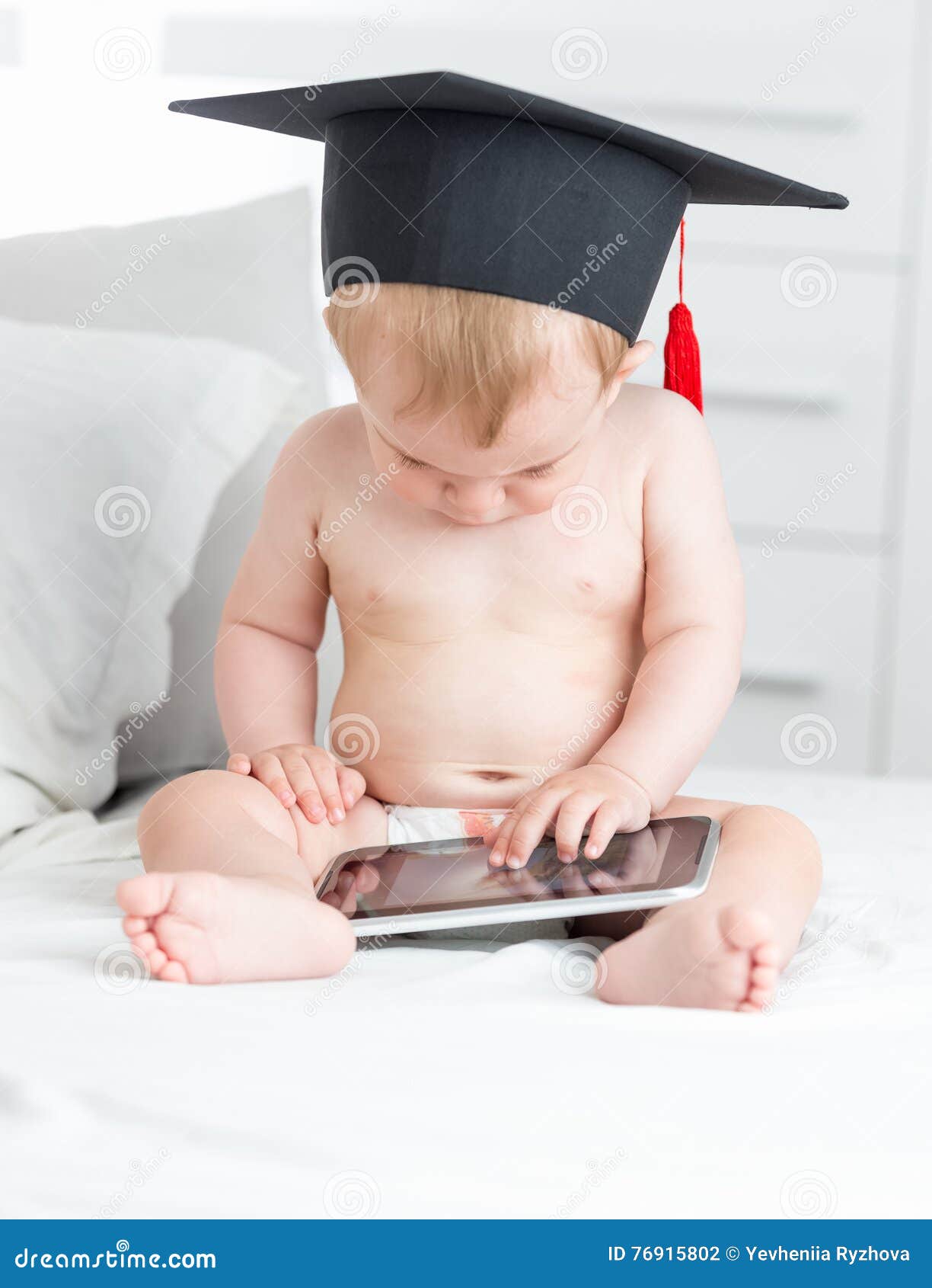 Beautiful Baby in Graduation Cap Using Digital Tablet Stock Photo ...