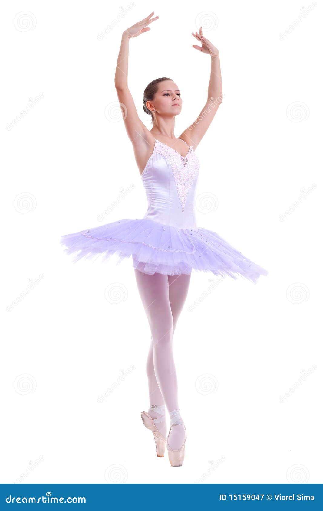 A Beautiful Ballerina Stands At The Ballet Rail And Stretches Her Legs ...