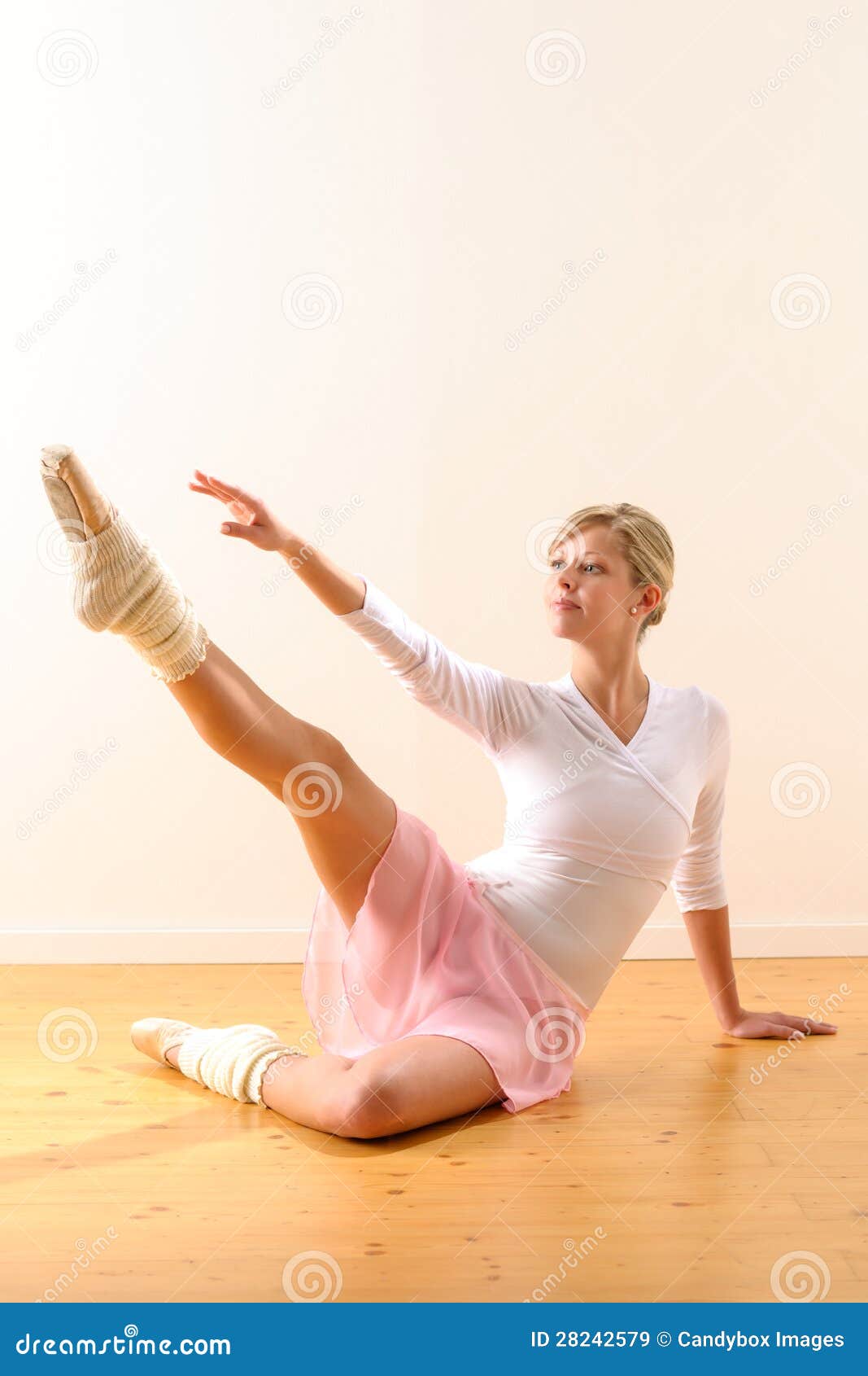 Beautiful Ballet Dancer Lifting Arm Towards Leg Stock Image Image Of