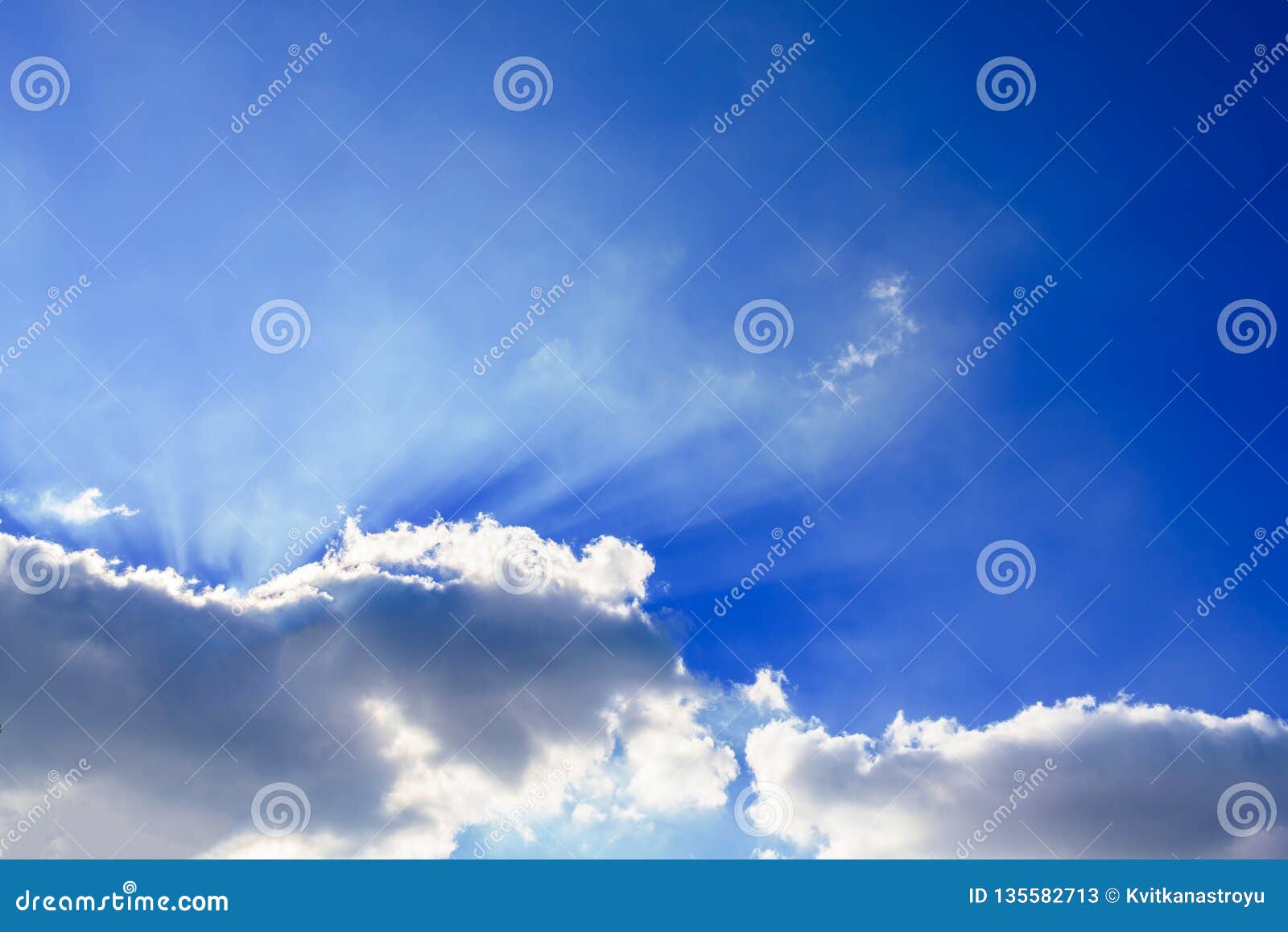 Beautiful Beam of Light and the Fluffy Clouds. Blue Sky with Sun Rays ...