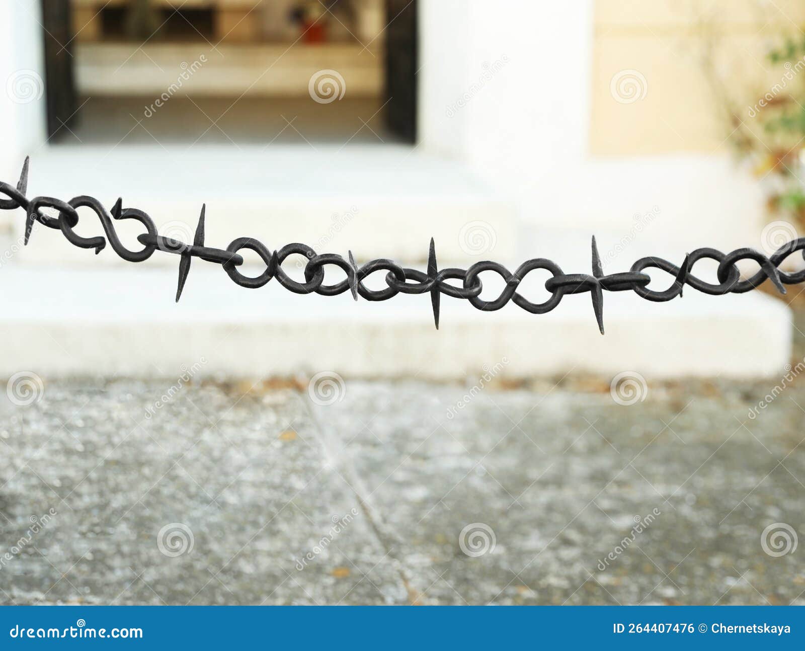 Beautiful Black Chain with Spikes Near Building Outdoors Stock Photo ...