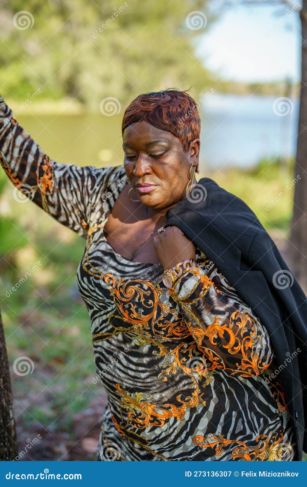 Beautiful Black Plus Sized Model Posing by a Tree in a Tranquil Park ...