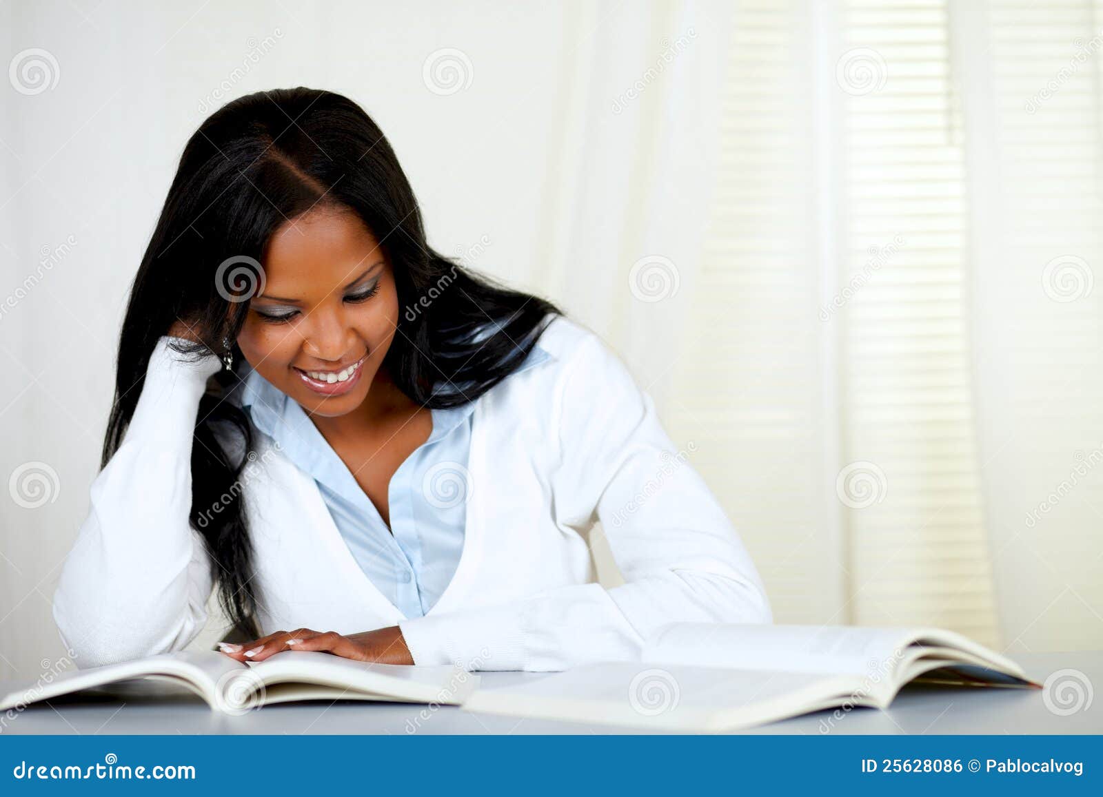 Beautiful Black Woman Smiling and Reading a Book Stock Photo - Image of ...