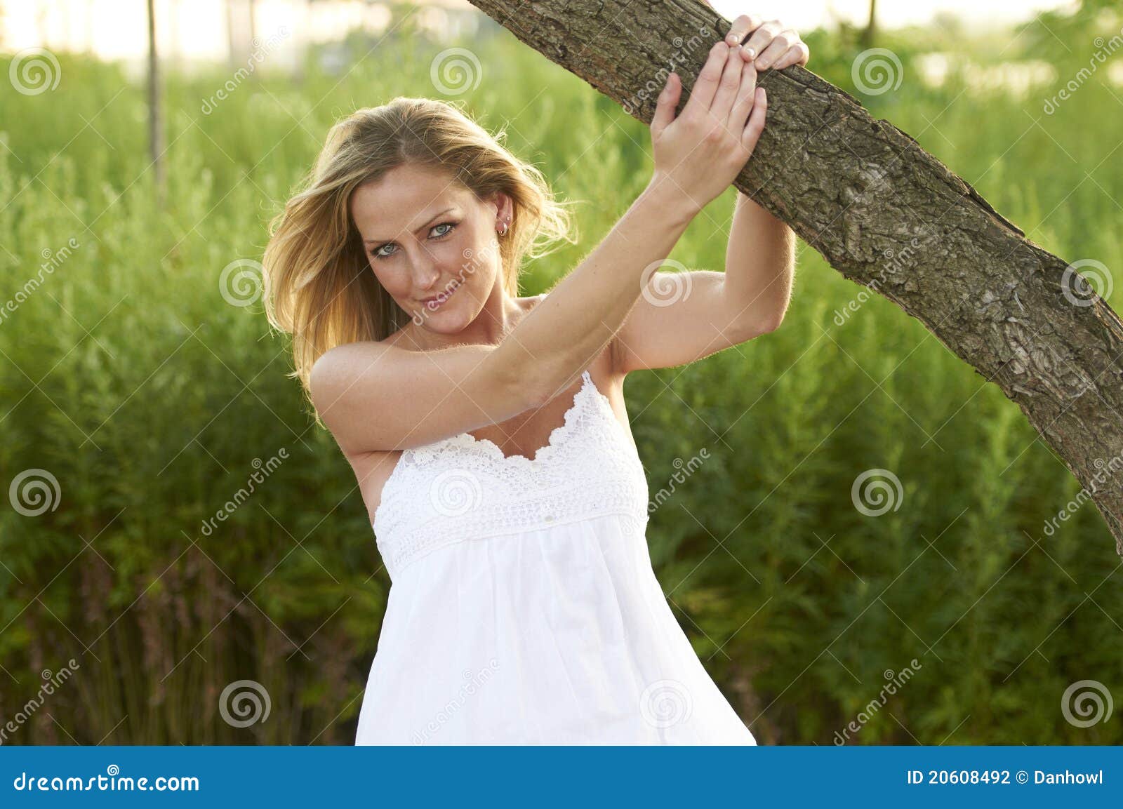 Beautiful Blond Under Tree stock photo. Image of playful - 20608492