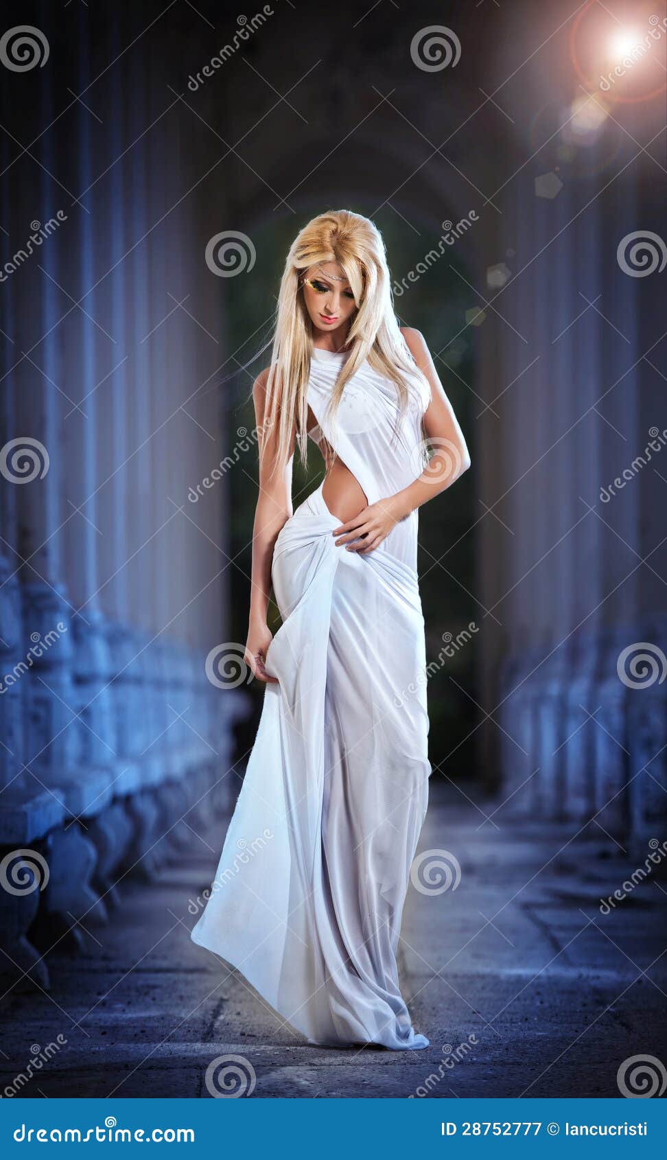 Beautiful Blonde Angel With White Light Wings And White Veil Posing