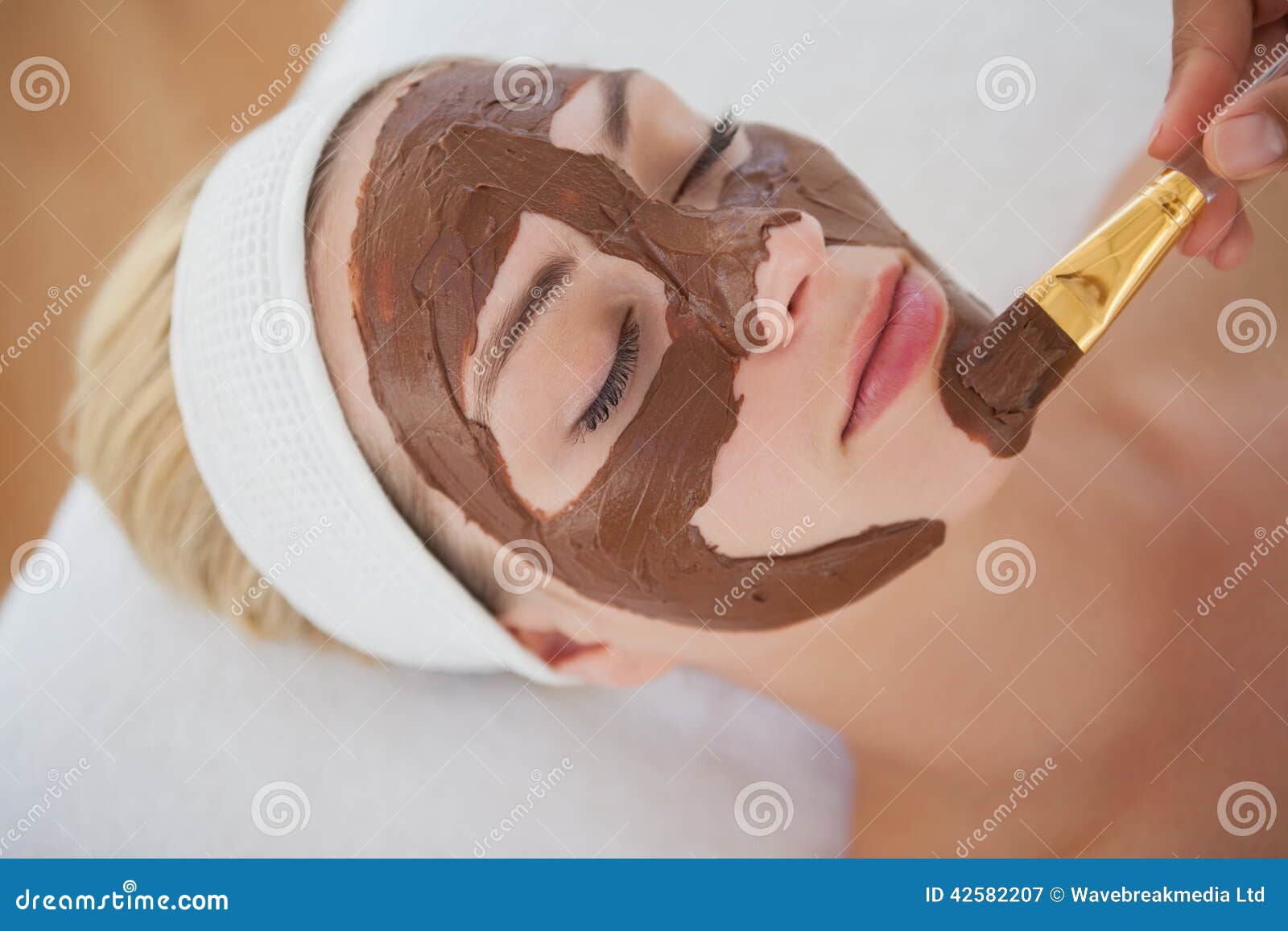 Beautiful Blonde Getting A Chocolate Facial Treatment Stock Image