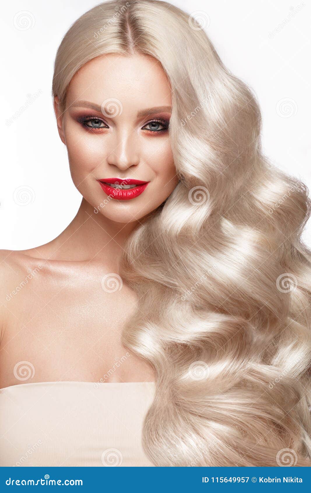 Beautiful Blonde In A Hollywood Manner With Curls Natural Makeup And