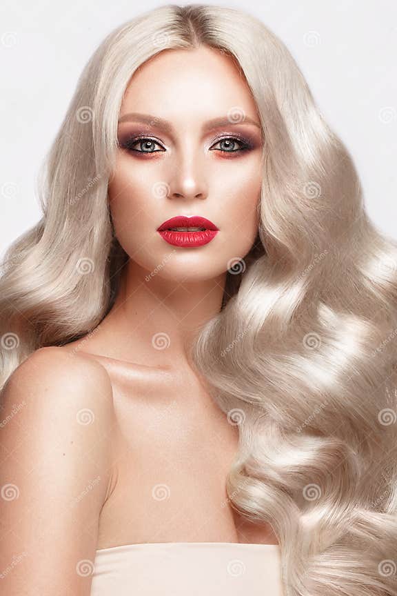 Beautiful Blonde In A Hollywood Manner With Curls Natural Makeup And