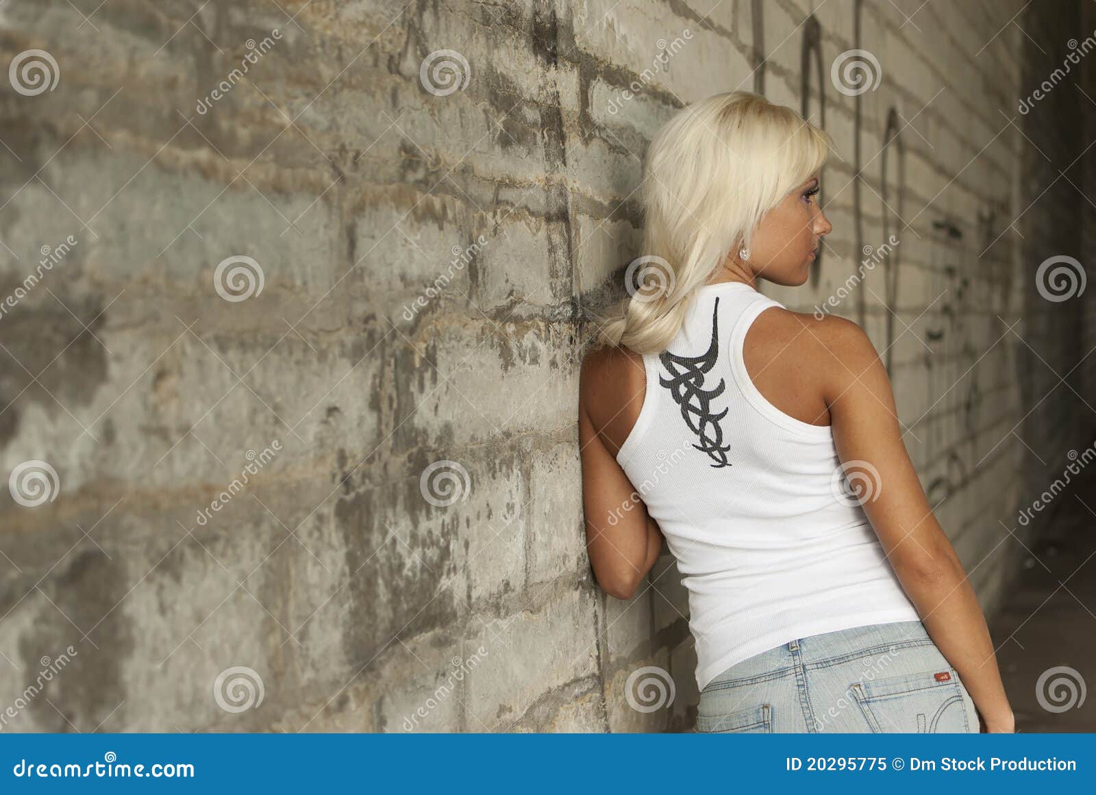 Beautiful Blonde Posing by the Wall Stock Image - Image of posing, face ...