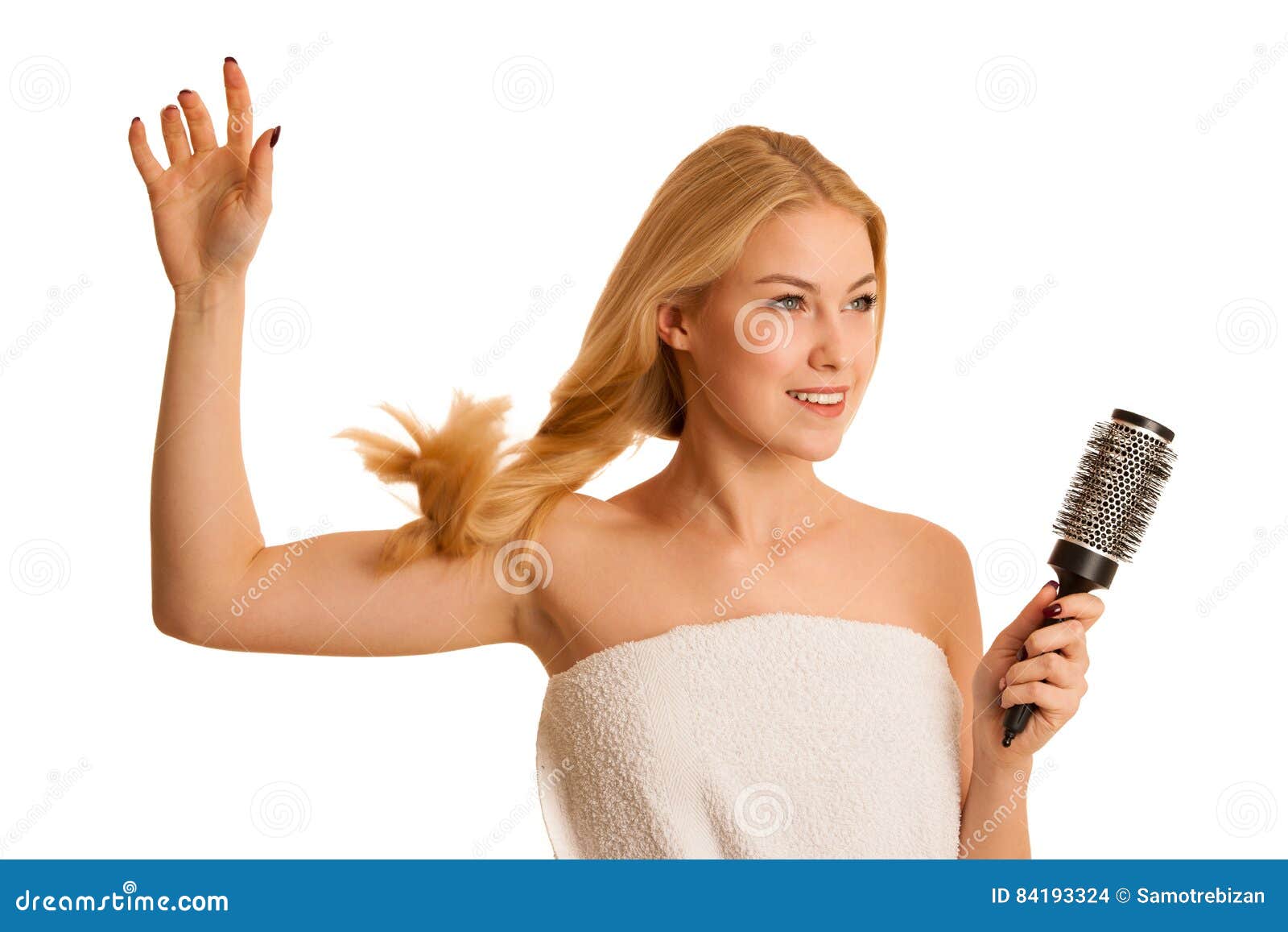 Beautiful Blonde Woman Brushing Her Hair As A Sign Og Hair Care Stock