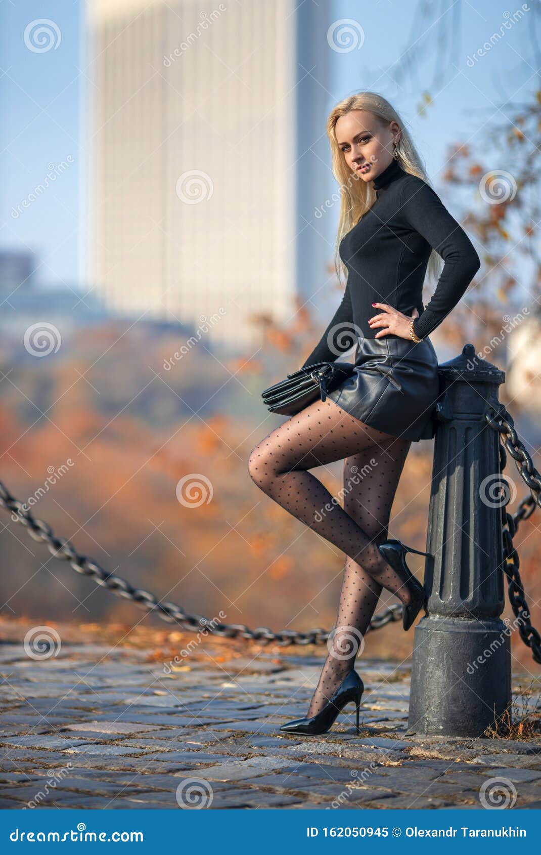 Beautiful Blonde Woman Posing Outdoor In The Autumn Park Stock Image