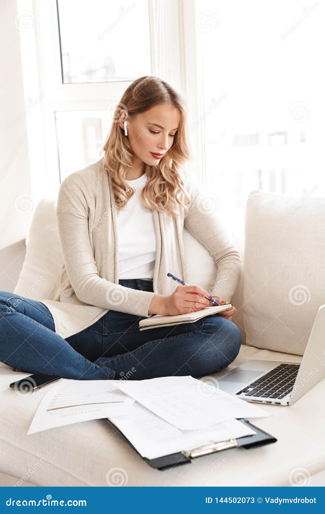 Beautiful Blonde Woman Posing Sitting Indoors at Home Using Laptop ...