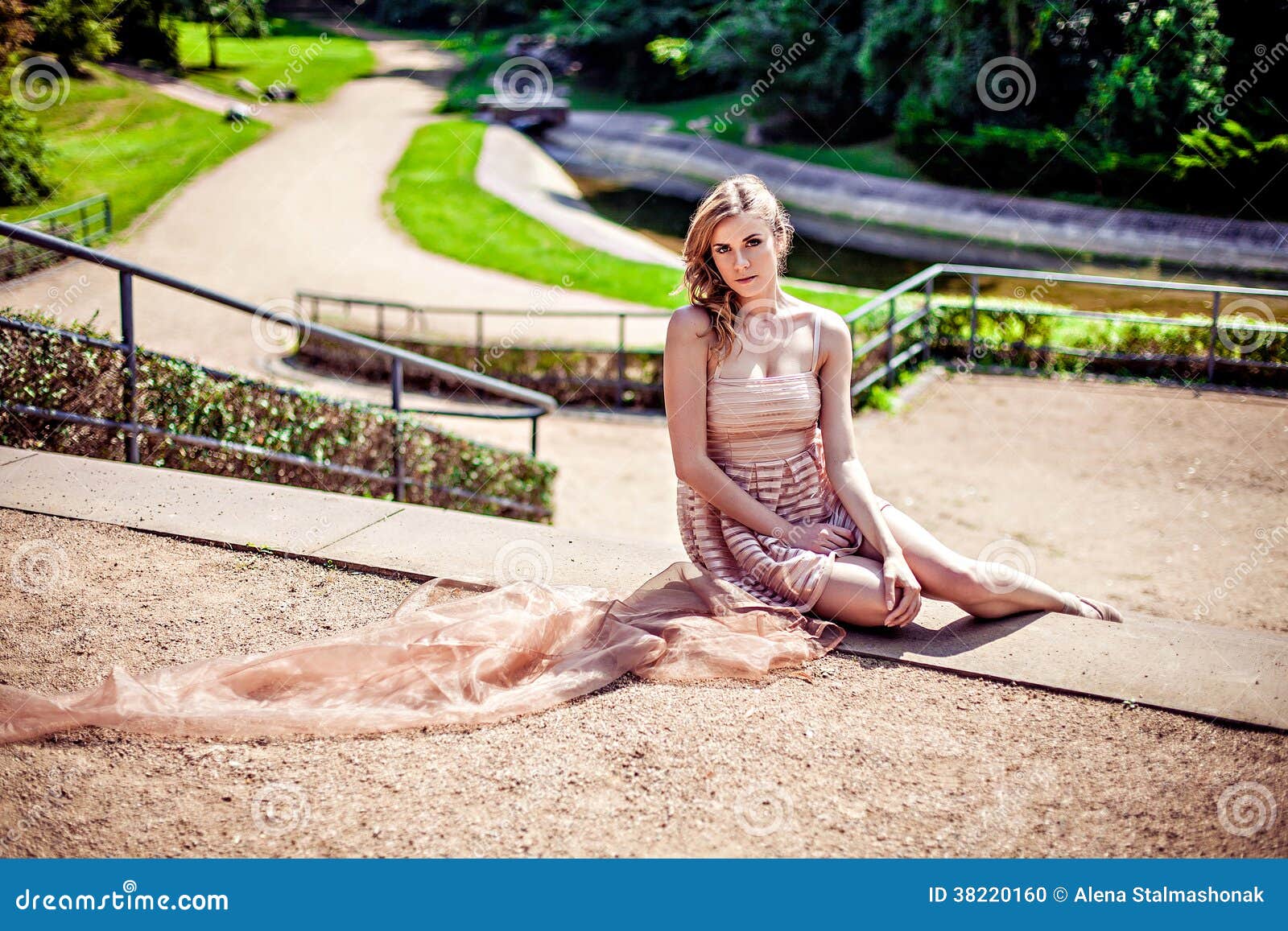 Beautiful Blonde Woman Sitting on the Steps in Park Stock Photo - Image ...