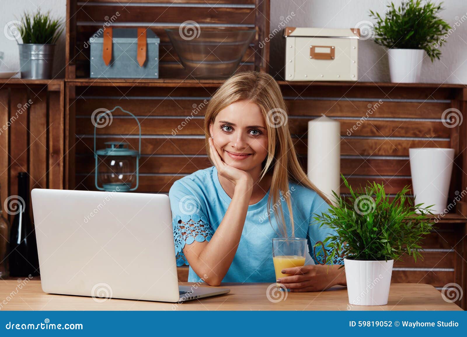 A Beautiful Blonde Woman Using Laptop Computer in Stock Photo - Image ...