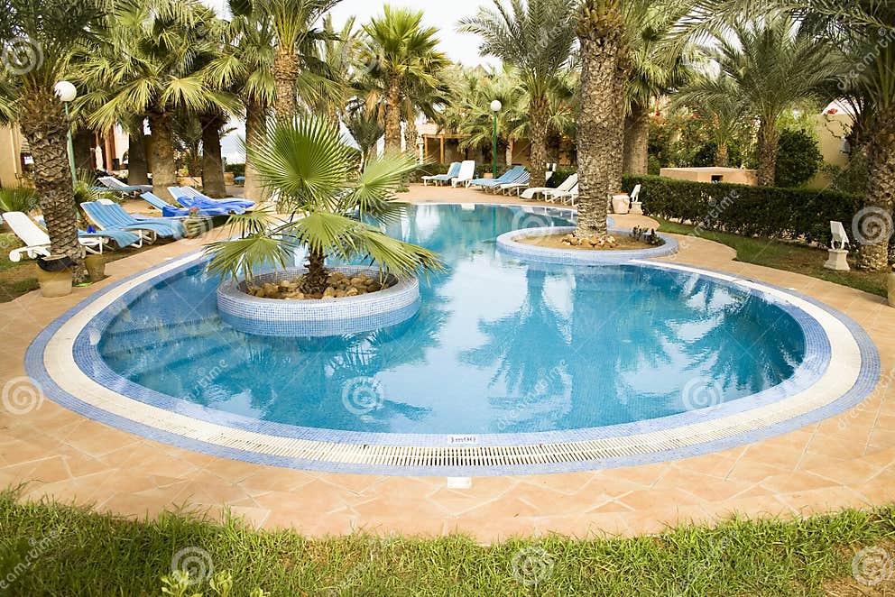 Beautiful blue hotel pool stock image. Image of bright - 9020441