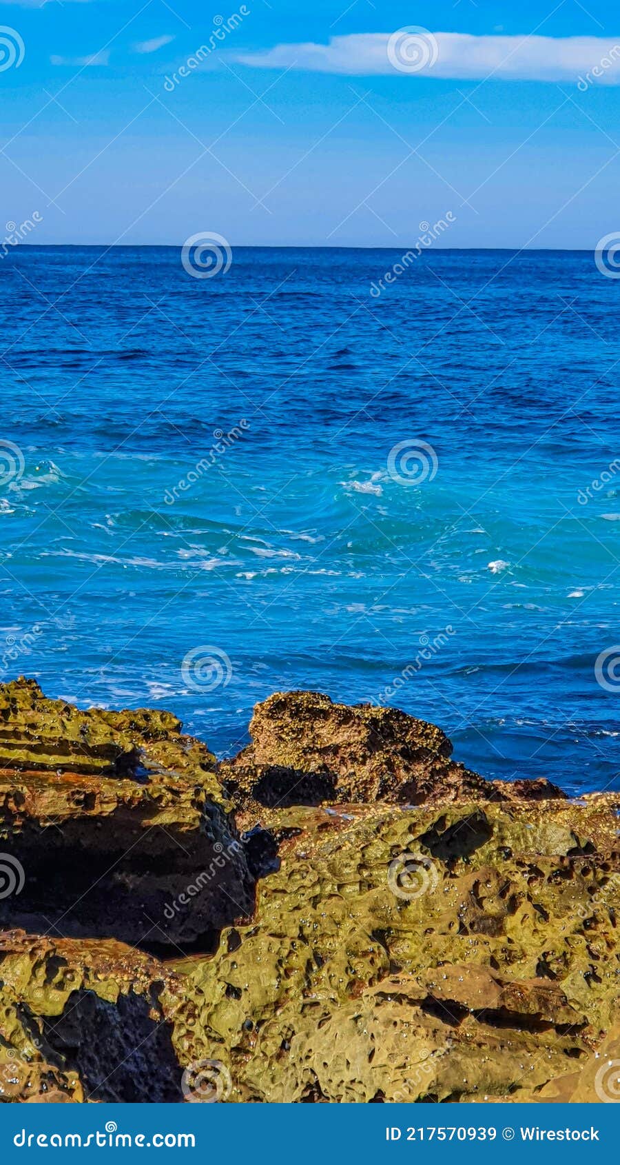 Beautiful Blue Ocean with Rocks in the Foreground Stock Image - Image ...