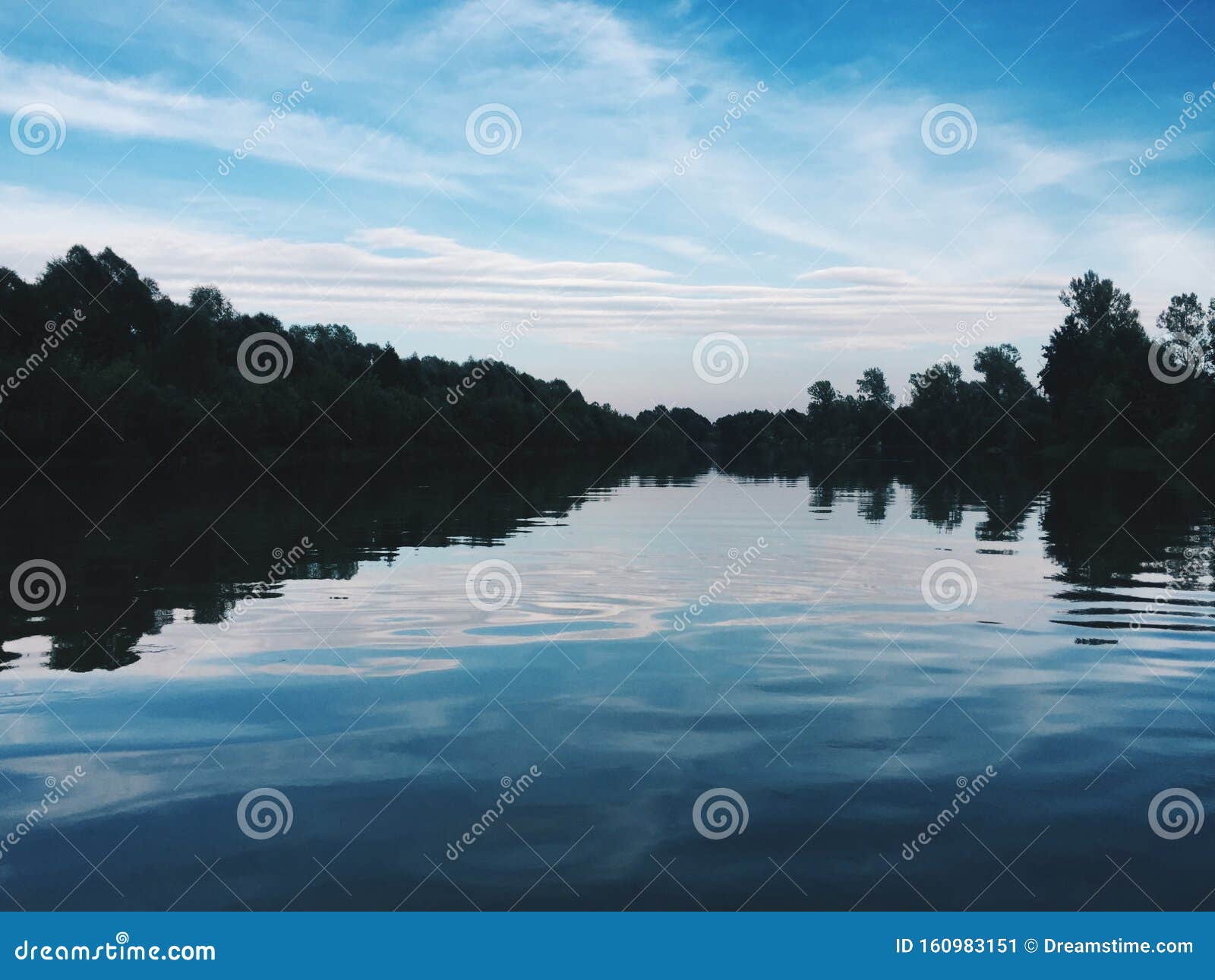 Beautiful Blue River with Reflecting Clouds in the Water in the Middle ...