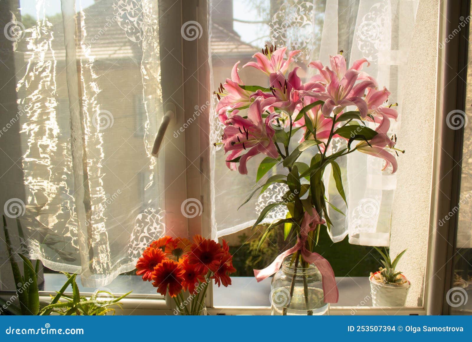 A Beautiful Bouquet of Flowers on the Window. Lilies on the Window ...