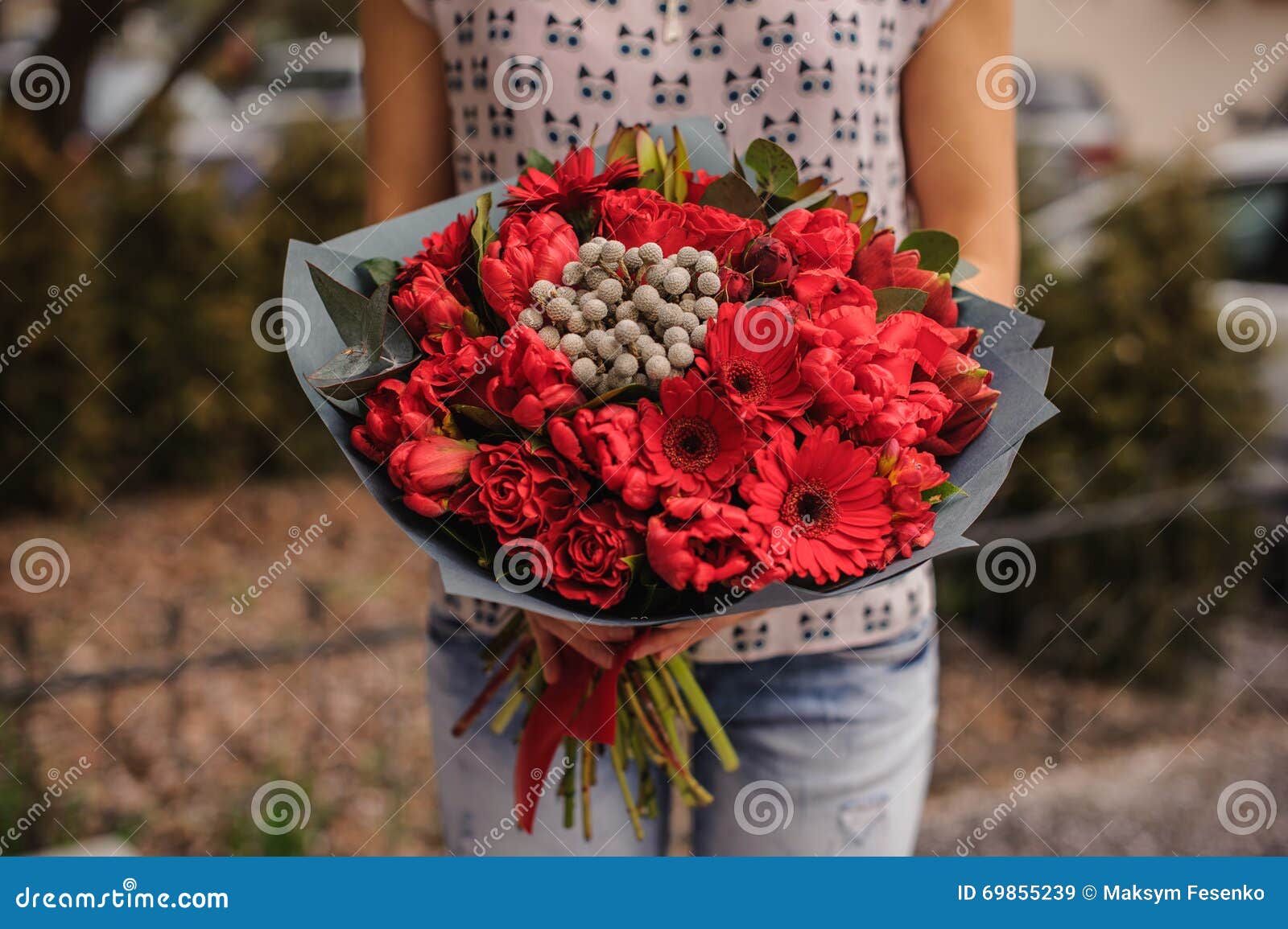 Beautiful Bouquet of Red Flowers with Black Paper in Hands Stock Image ...