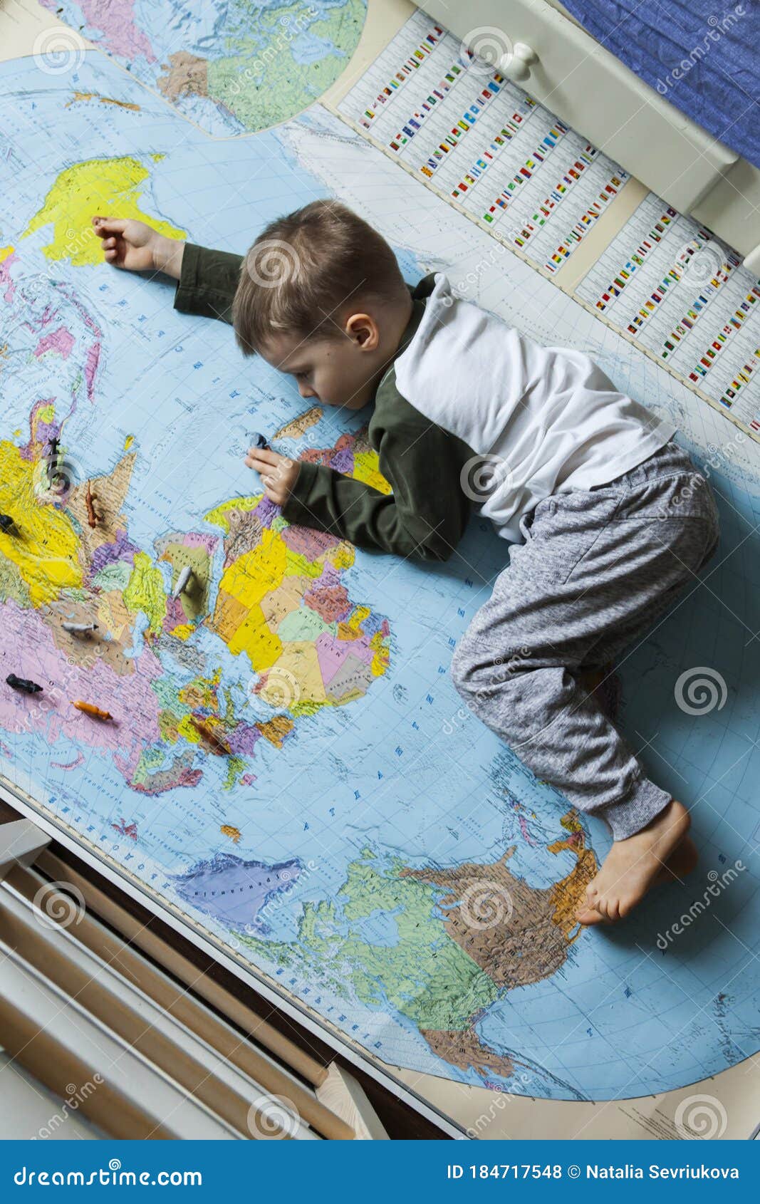 Beautiful Boy Lies on a World Map Stock Photo - Image of game, floor ...