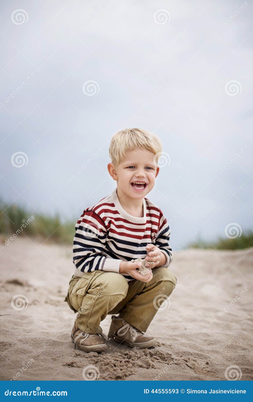 Beautiful Boy Playing with Sand on the Beach Stock Image - Image of ...