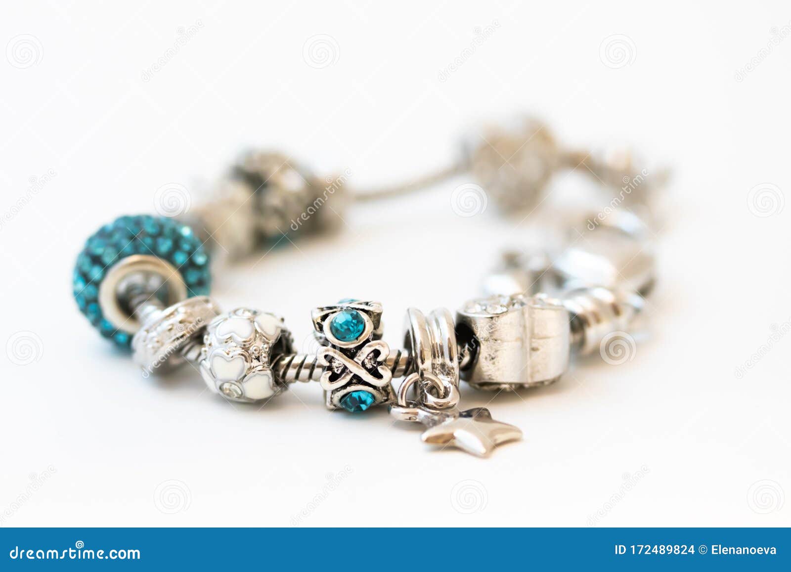 Beautiful Bracelet with Charms Isolated on White Background Stock Photo ...