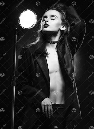 Beautiful Braless Girl With Red Lips Wearing An Unbuttoned Black