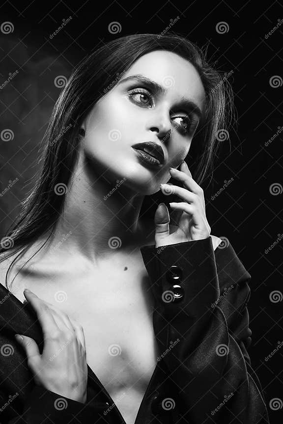 Beautiful Braless Slim Girl Wearing A Unbuttoned Black Blazer With A