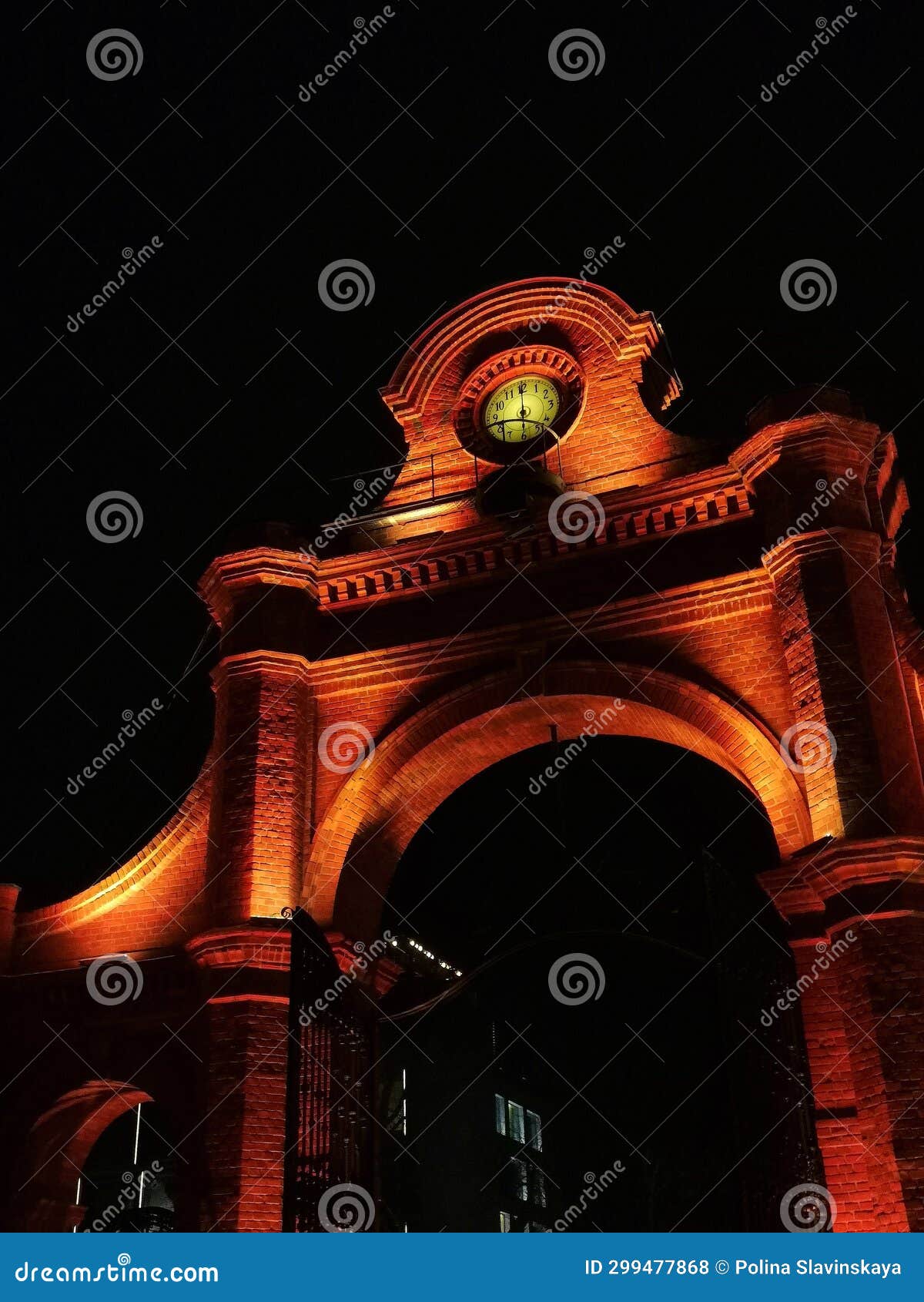 Beautiful Brick Arch with a Gate and a Clock on Top Stock Photo - Image ...