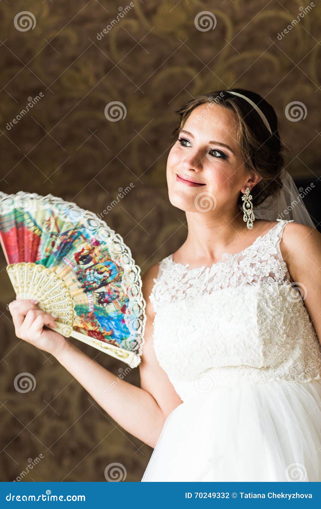 Beautiful bride with a fan stock photo. Image of attractive - 70249332